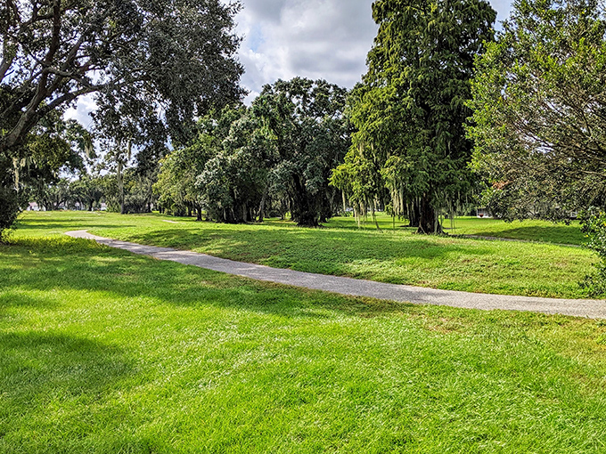 Walking paths wind through lush greenery, offering peaceful strolls where the only rush hour is a family of ducks crossing.