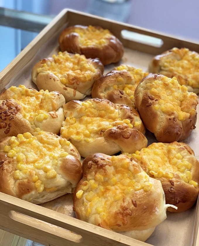 Corn-topped buns that achieve that perfect balance of savory and sweet—like the comfort food you never knew you were missing.