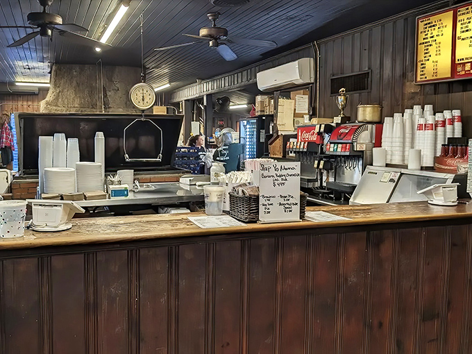 Behind this counter, barbecue magic happens with the efficiency that comes only from decades of practice and unwavering dedication to the craft.