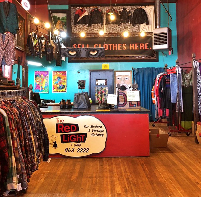 The beating heart of Red Light's operation, where fashion treasures begin their second acts and the watchful cat eyes remind you to "SELL CLOTHES HERE."