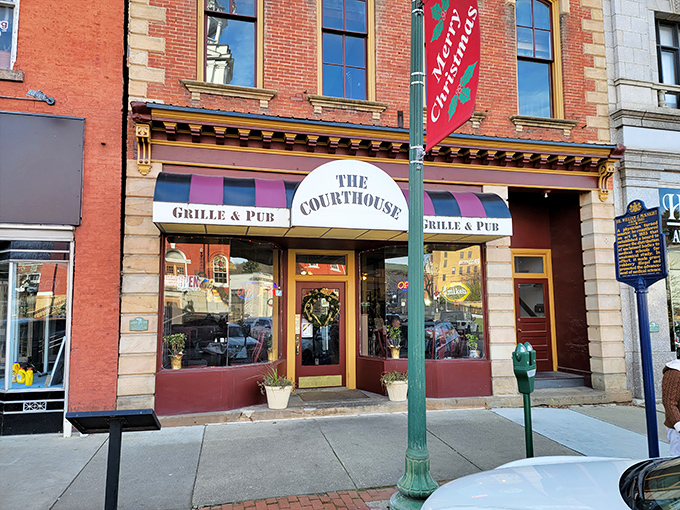 The Courthouse Grille & Pub promises comfort food and conversation in equal measure, with its welcoming awning beckoning hungry travelers inside.