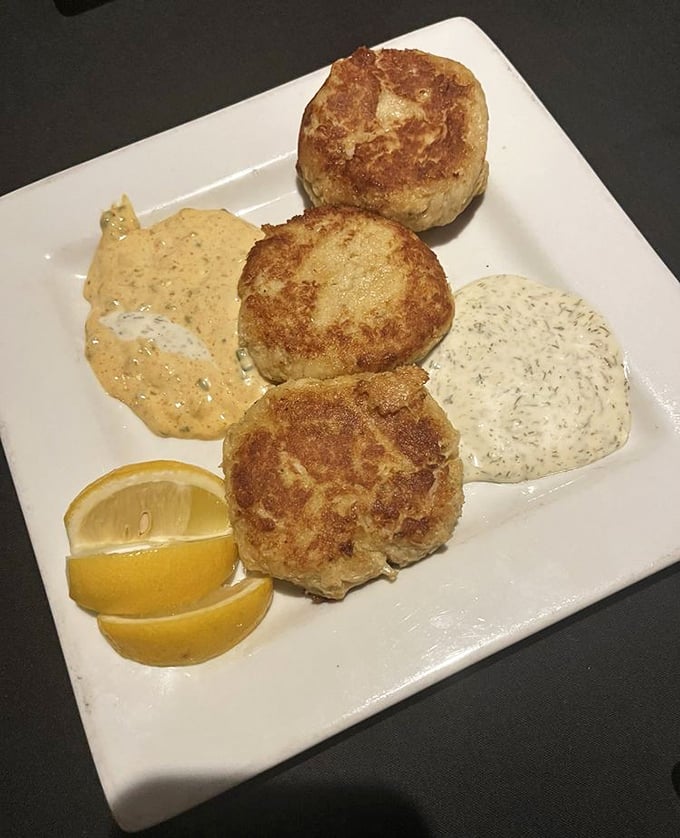 These golden crab cakes with their crispy exterior and tender center perform a delicate balancing act of textures and flavors.