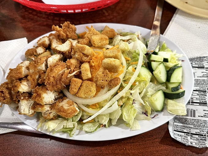 A crispy chicken salad that solves the eternal dilemma of "I should eat healthy, but I want fried chicken" in one brilliant compromise.