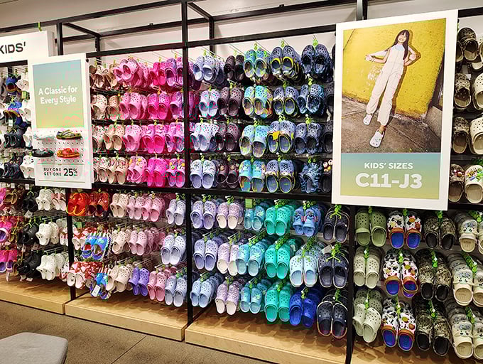 The Crocs rainbow wall&mdash;where fashion practicality meets foot comfort in a dazzling display that makes you think, "Maybe I DO need turquoise clogs!"