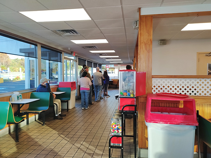 The lunch line forms with the patience of pilgrims &ndash; locals and tourists united in the universal language of barbecue anticipation.