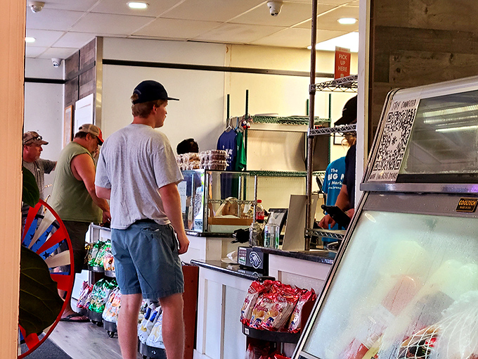 The lunch rush brings everyone together, united in the universal pursuit of sandwich perfection.