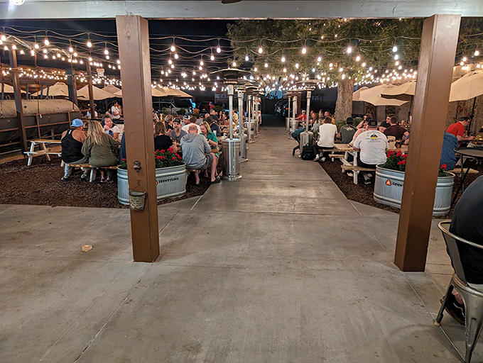 Evening dining under string lights&mdash;where BBQ brings strangers together and turns them into friends with sauce-stained smiles.