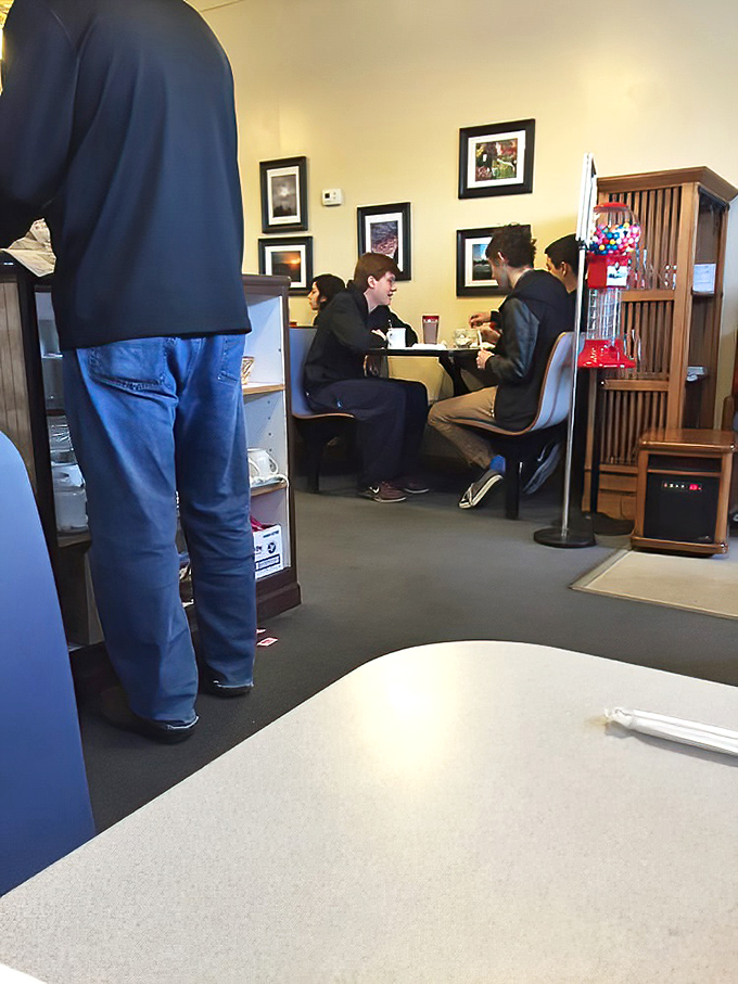 Young diners enjoying the timeless pleasure of good food and conversation&mdash;some traditions never need updating.