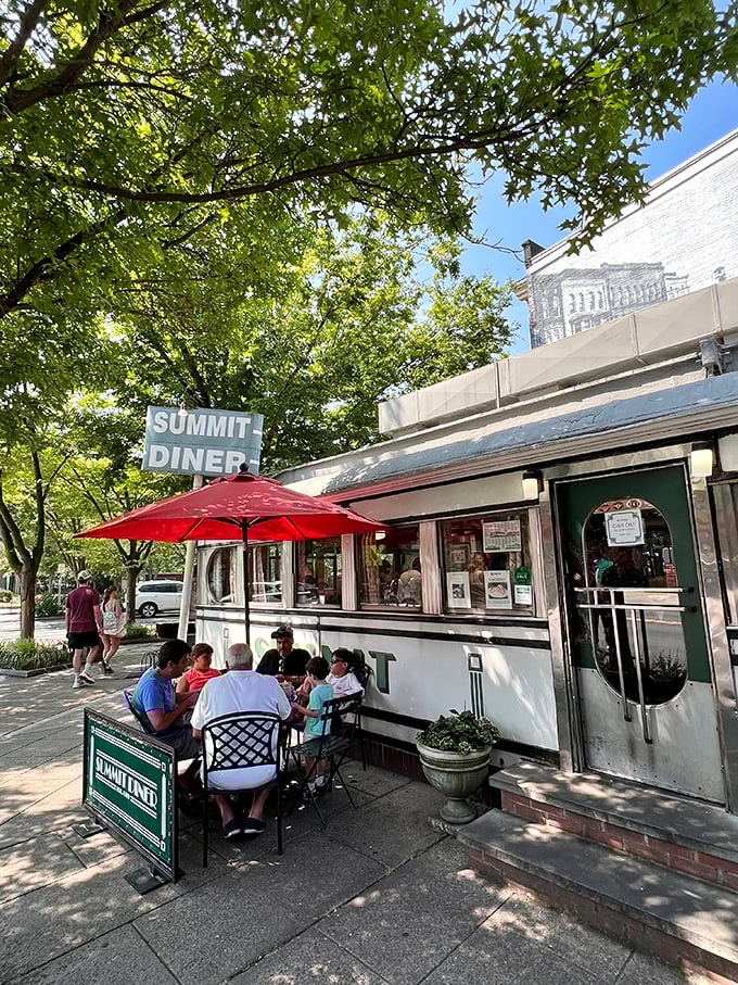 Outdoor dining at Summit Diner: Where locals gather under red umbrellas to debate Taylor ham vs. pork roll while enjoying both.