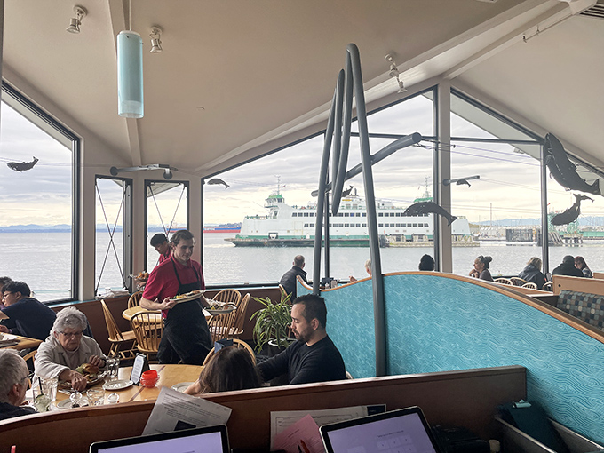 Where locals and visitors unite in the pursuit of seafood excellence. That ferry in the background isn't just transportation—it's part of the ambiance.