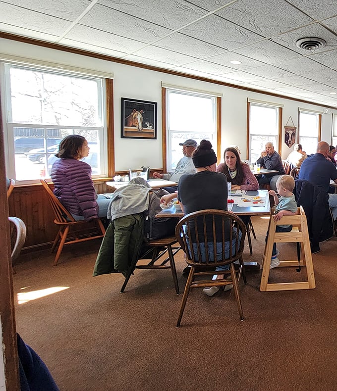 Sunlight streams through windows, illuminating a dining room where families and friends gather to start their day on the right note.