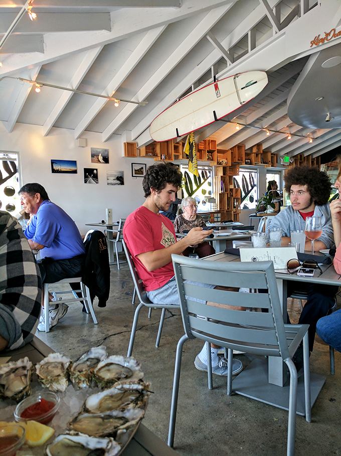 Where seafood enthusiasts gather under surfboards and string lights – the kind of place where strangers become friends over shared oyster platters.