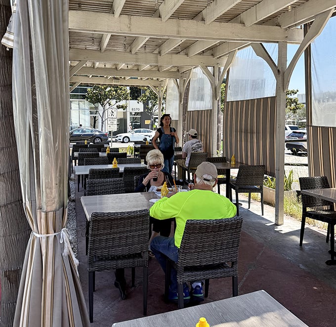 Happy diners enjoying the al fresco experience - because sunshine makes everything taste better, even pastrami.