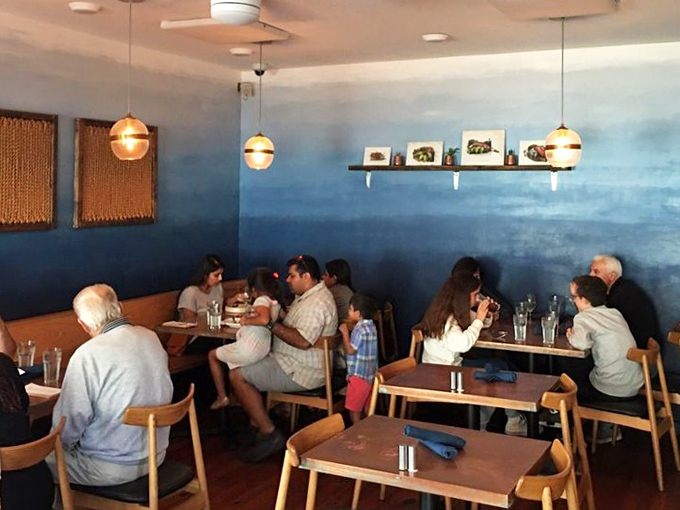 Happy diners who've discovered what the rest of us are missing - look at those satisfied faces.