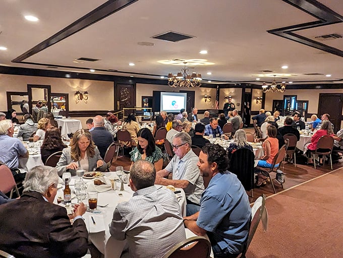Happy diners engaged in that universal language: the appreciation of a great meal shared. Conversations flow as freely as the wine.