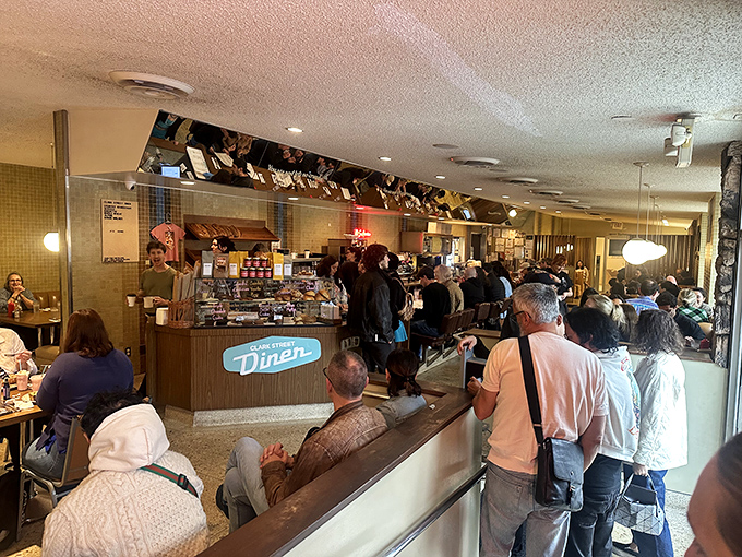 The lunch counter buzz&mdash;where strangers become temporary neighbors united by the universal language of "pass the ketchup, please."