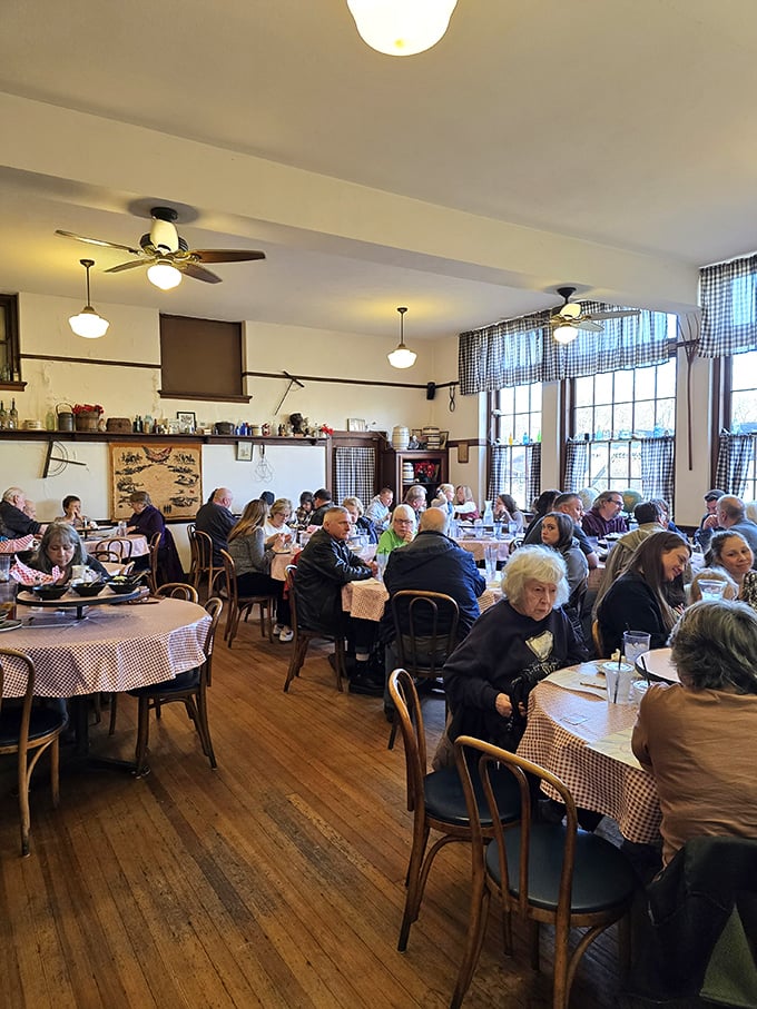 Fellow diners sharing stories and smiles, proving good food creates instant community among strangers.