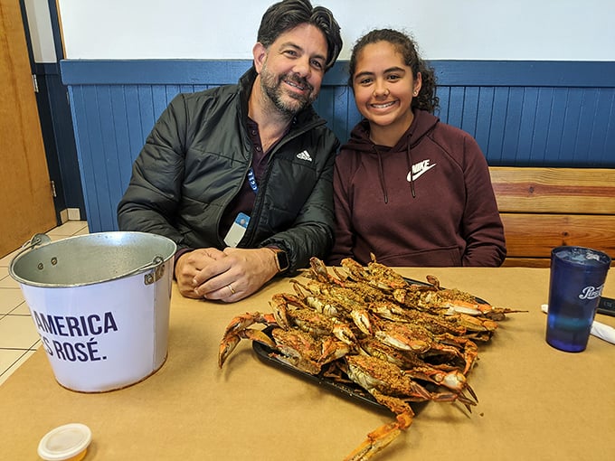 The true measure of great seafood? The smiles on diners' faces as they prepare to tackle a tray of perfectly seasoned crabs. 