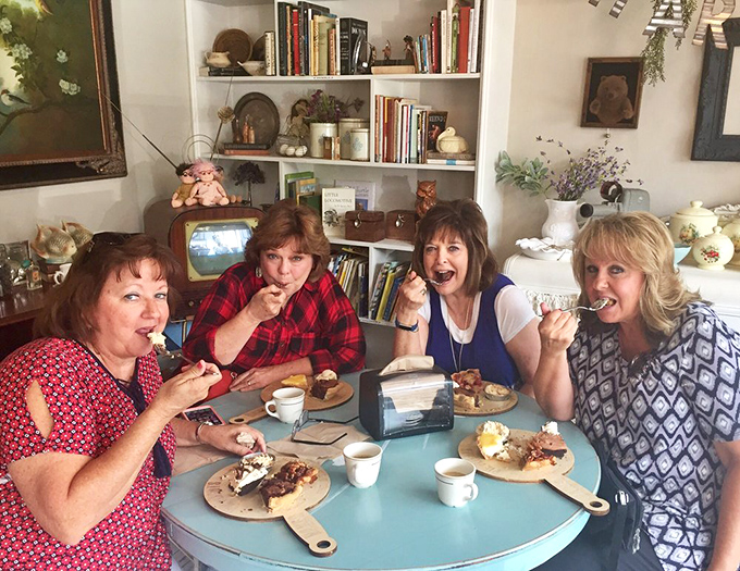 Friends gathered around pie flights prove that happiness is, indeed, best when shared. Their expressions say everything words cannot.