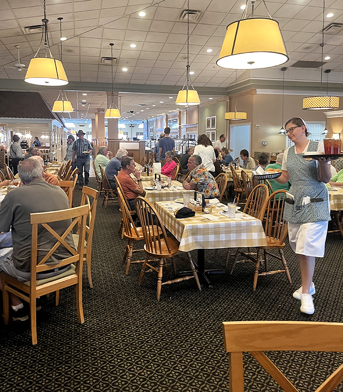 Diners bask in the warm glow of pendant lights, plotting their next buffet strategy while servers glide between tables with practiced efficiency.