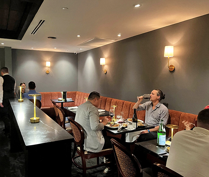 Diners engaged in the serious business of pleasure&mdash;notice how nobody's looking at their phones when there's steak to be contemplated.
