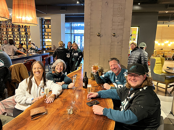 Happy diners in their natural habitat, contemplating whether dessert is really optional.