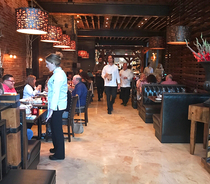 The ballet of fine dining in progress&mdash;servers gliding between tables while diners engage in that universal ritual of falling in love with their food.