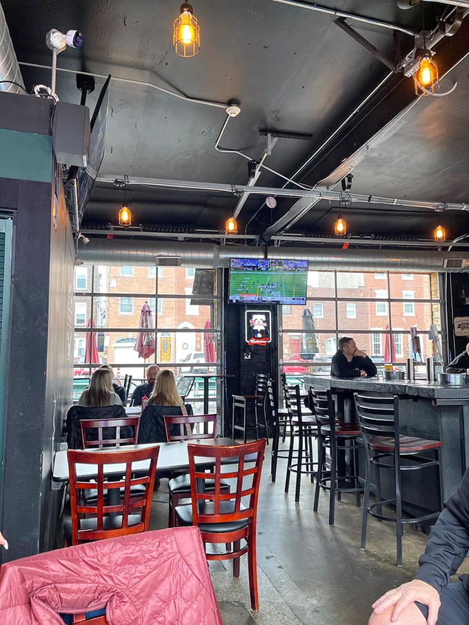 Patrons find their happy place at Jaxx's bar, where conversations flow as freely as the beer taps.