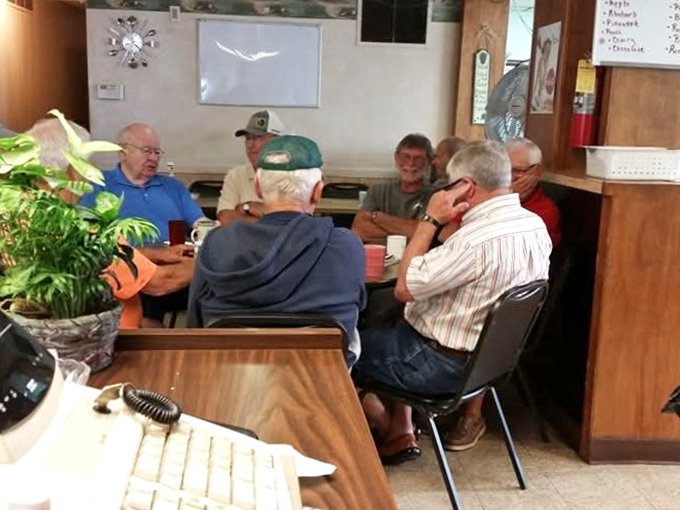 The morning crew—where friendships have been maintained over countless cups of coffee and shared stories about grandkids and garden yields.