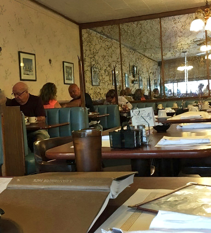 Where locals gather to solve the world's problems over coffee and pie. The real social network has always been the diner booth.