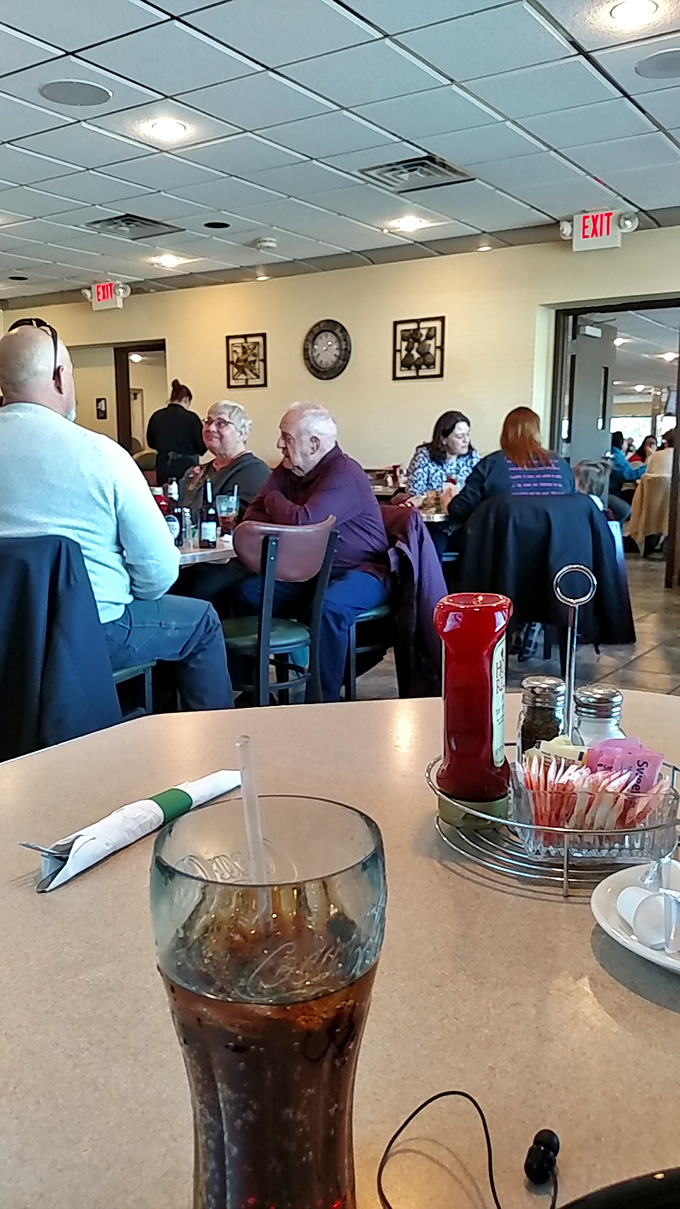 Local diners gather around tables, creating the kind of community atmosphere that makes restaurants feel like home.