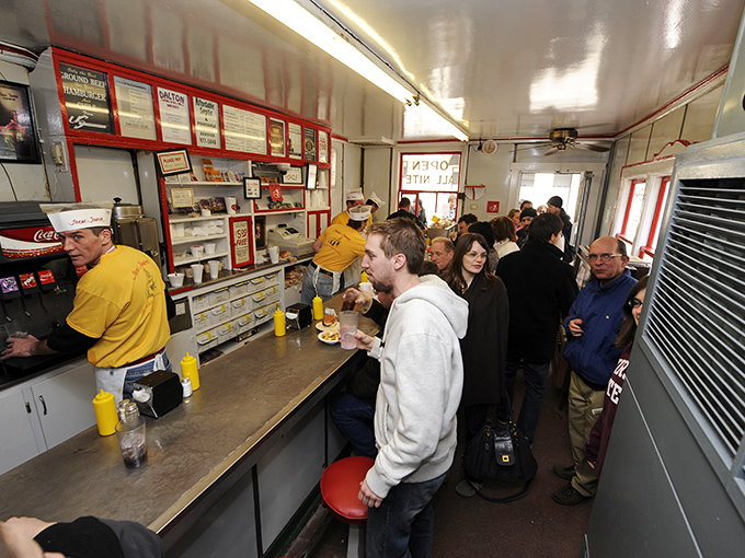 Where strangers become neighbors over burgers and conversation—the original social network, no Wi-Fi password required.