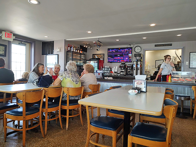 Where locals gather to share news, solve world problems, and demonstrate the proper technique for savoring every last bite.