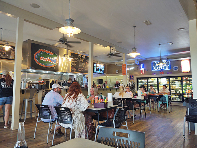 Florida Gators memorabilia watches over diners – because even in a seafood paradise, college football allegiances must be properly displayed.