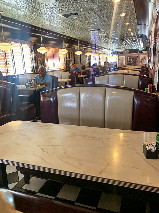 Booths designed for lingering conversations and the kind of comfortable seating that whispers, "Go ahead, order dessert. I'll wait."