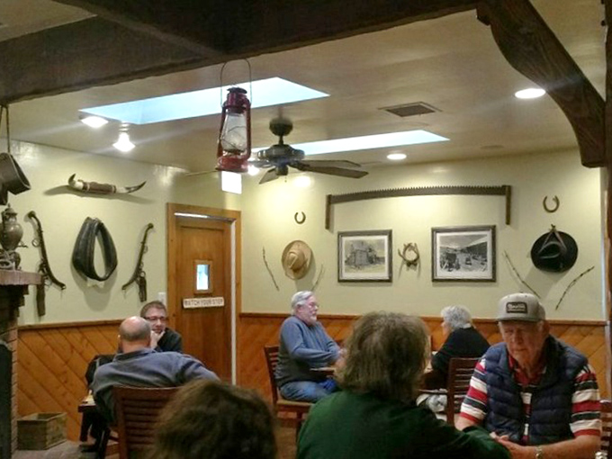Where cowboy memorabilia meets comfort &ndash; a dining room that says "take your time, partner" while vintage photos remind you of simpler days.
