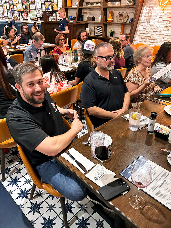 The true measure of a great restaurant: tables filled with happy diners sharing stories, laughter, and occasional envious glances at neighboring plates.