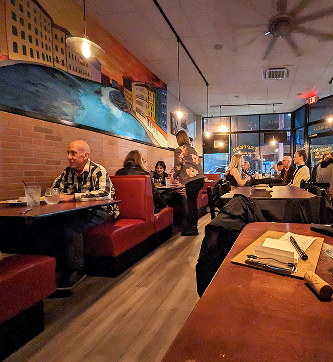 Where strangers become neighbors over plates of pasta. Notice how nobody's looking at their phones? That's the power of food worth focusing on.