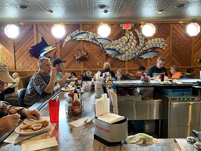 Where fishing tales and food appreciation meet&mdash;the marlin artwork watches over diners like a benevolent sea guardian approving their choices.