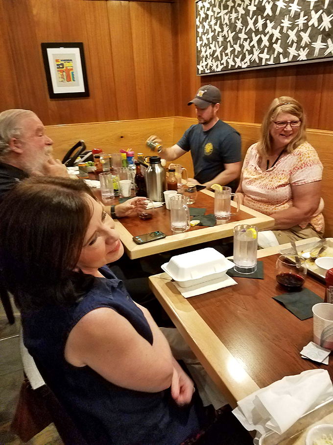 The universal language of barbecue brings folks together. That look of anticipation says everything about what's about to happen.