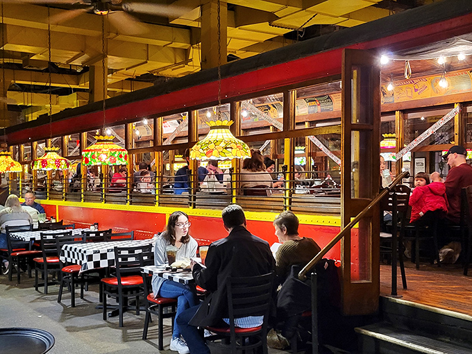 Dinner and a show&mdash;the trolley's interior offers both. Those stained glass windows filter the light like rose-colored glasses for your dining experience.