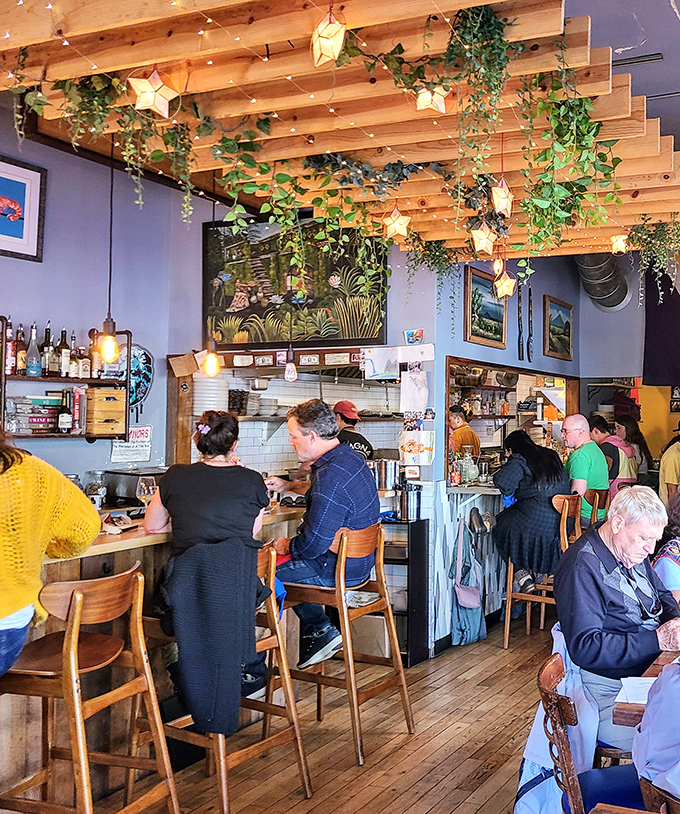 Happy faces around shared plates - the universal language of great food bringing people together perfectly.