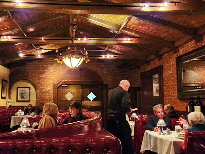 Where conversations happen in hushed tones and servers glide between tables like they've been doing this dance for decades.