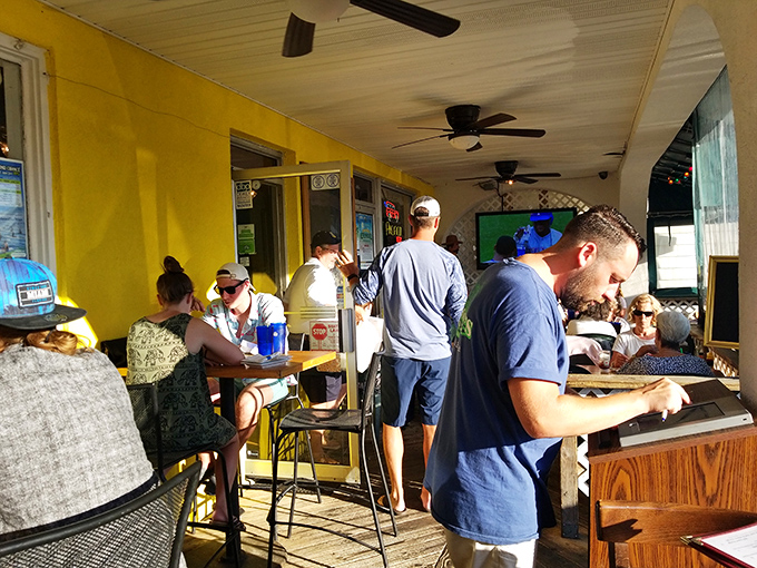 The outdoor dining area buzzes with the energy of people making memories between bites of legendary crab cakes.