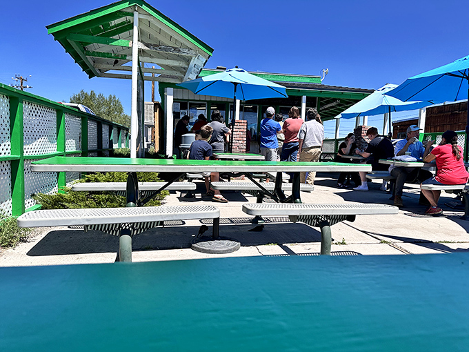 Blue umbrellas shield hungry patrons from the high-altitude sun while they wait for burgers that will make the brief line seem like time well invested.