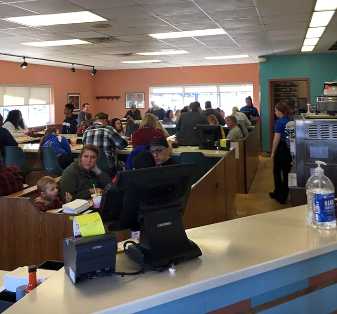 Booths filled with families and friends tell the real story—this isn't just a restaurant, it's where Warren's community comes together over shared hot dog love.