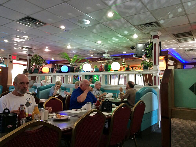 Regulars settle into their favorite spots like they're returning to their second living room, coffee mugs permanently attached. 