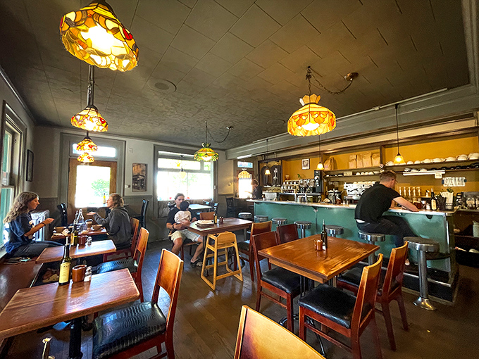 The cafe's interior feels like the living room of that cool friend who somehow makes mismatched furniture look intentionally chic.