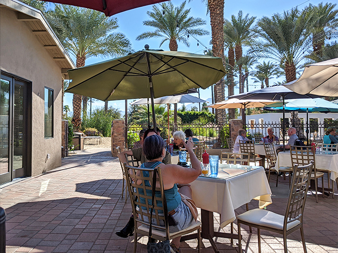The outdoor patio offers date palm views and desert breezes&mdash;nature's air conditioning with a side of agricultural heritage.