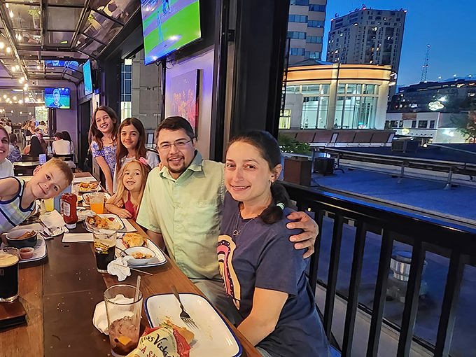 Happy diners enjoying their meal. The universal expression of "I've made an excellent life decision" captured in one perfect moment.